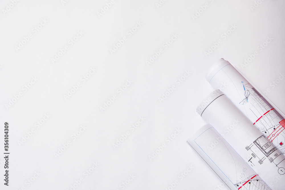 Rolled engineering drawings at white background with copy space Stock ...