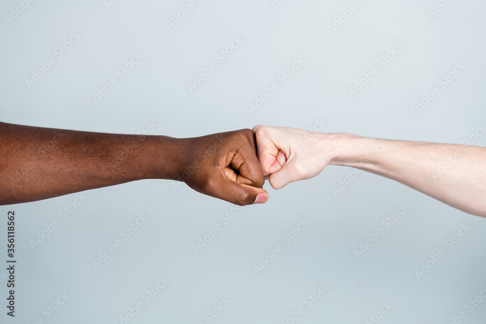 Poster Closeup photo of two arms different race skin colors multinational friends antir – Wall ...