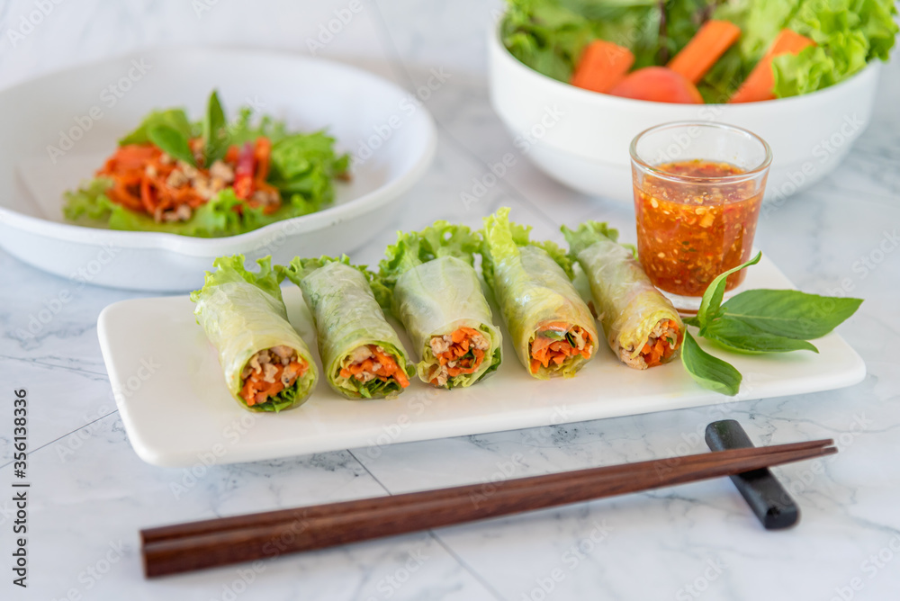 Fresh rice sheet spring rolls with minced pork, vegetable and spicy ...