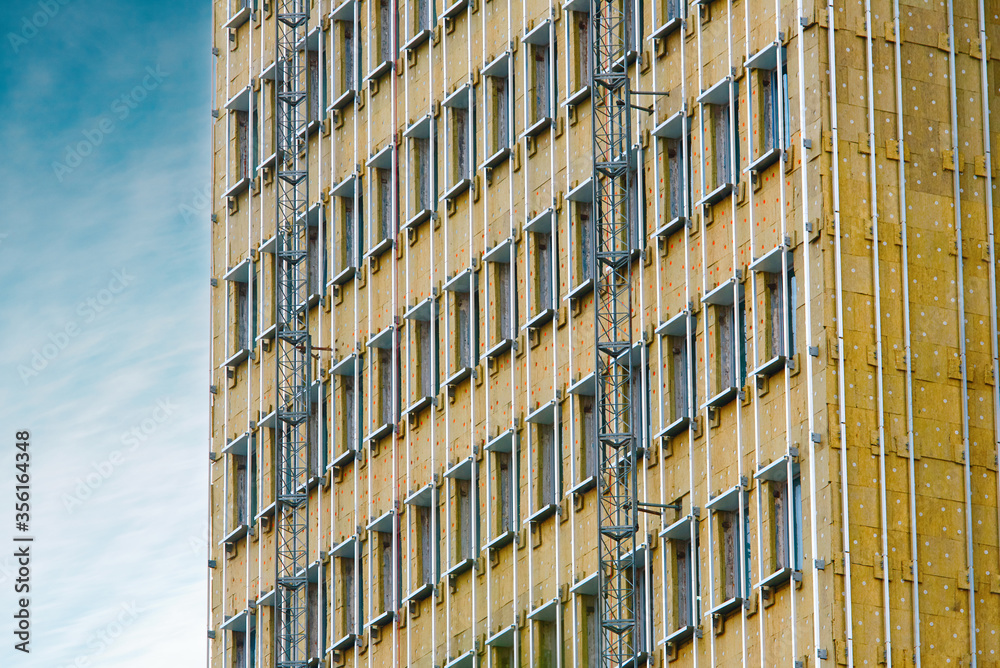 External wall thermal insulation with mineral wool slab around the ...