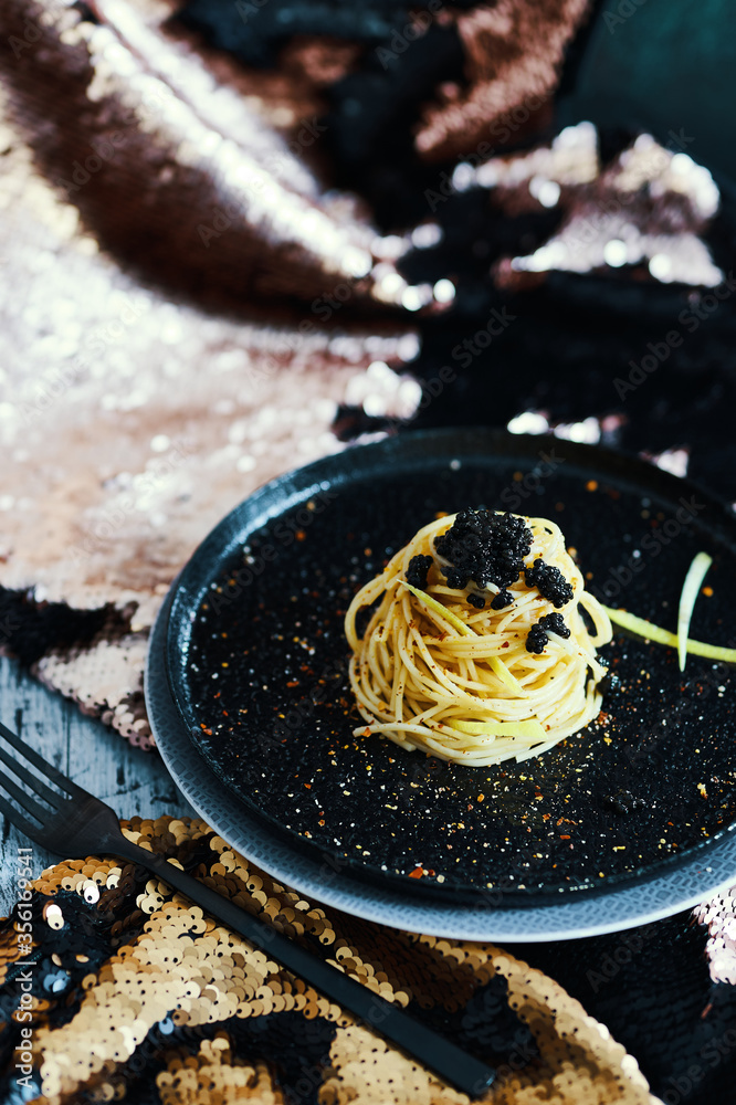 spaghetti with black caviar Stock Photo | Adobe Stock