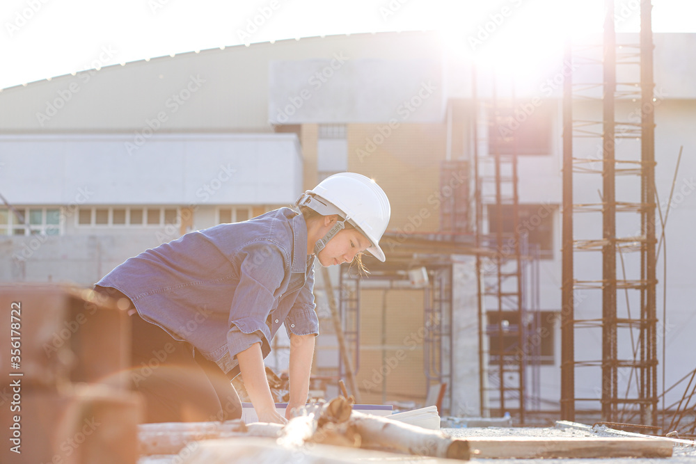 Scaffolding in construction area. Engineering woman looking on ...