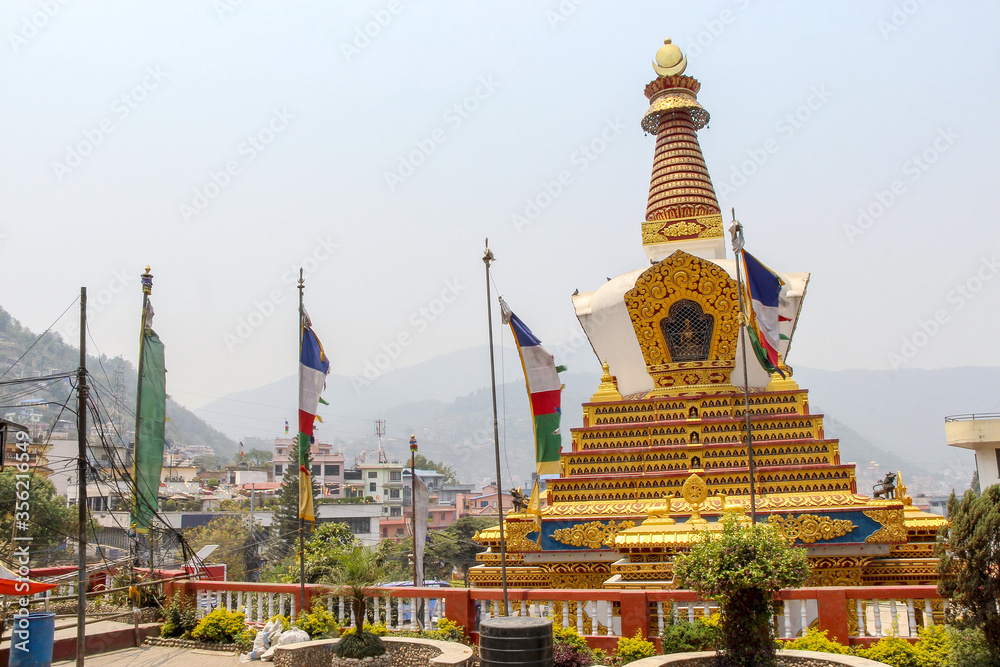 View of large beautiful gold colored biddhist stupa located in Amideva ...