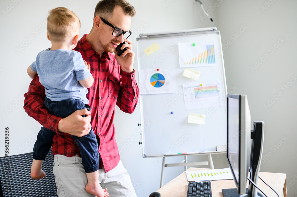 Dad must to work from home and cares of little kid. Busy father is ...