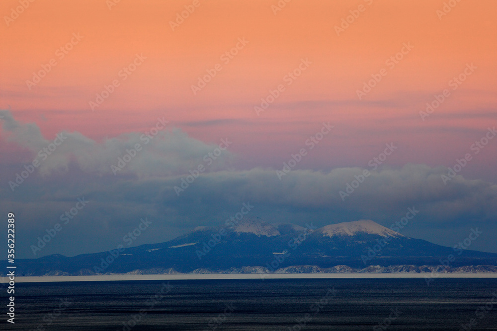 Japan winter landscape, hill with trees and snow. Rausu is mountain ...