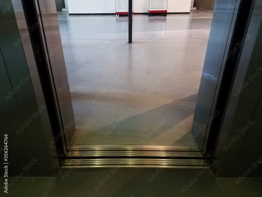 inside an elevator with shiny metal doors Stock Photo | Adobe Stock