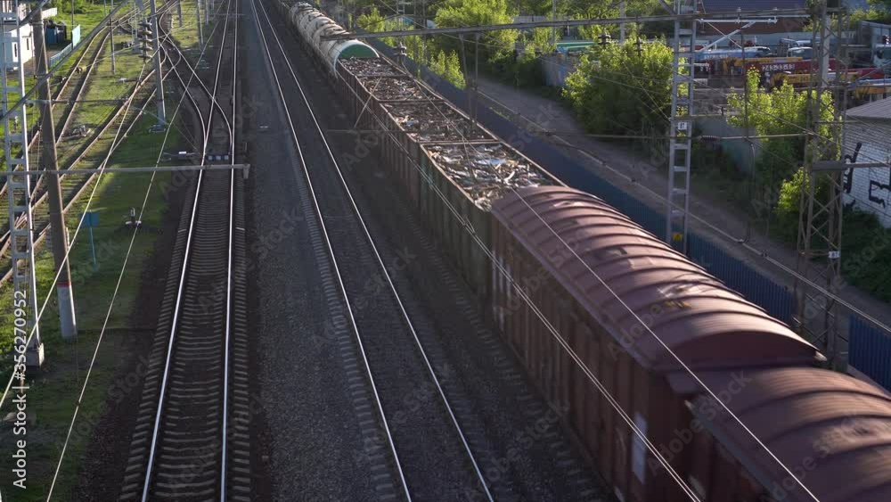 Freight train carries cargo. View of the train from above. Rail ...