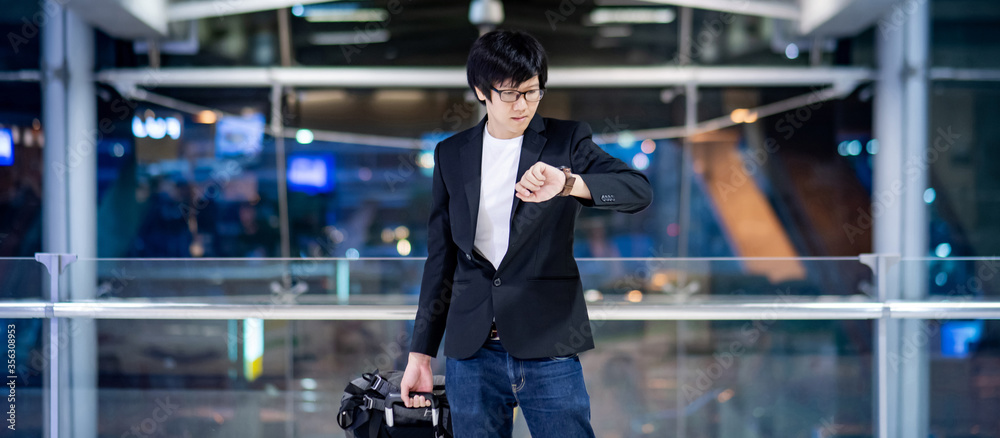 Business travel and baggage claim check-in concept. Smart Asian ...