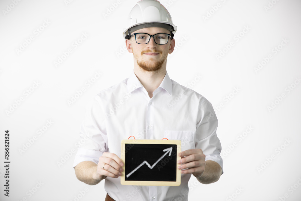 Happy mining engineer holding sign with up arrow rising oil quotes and ...