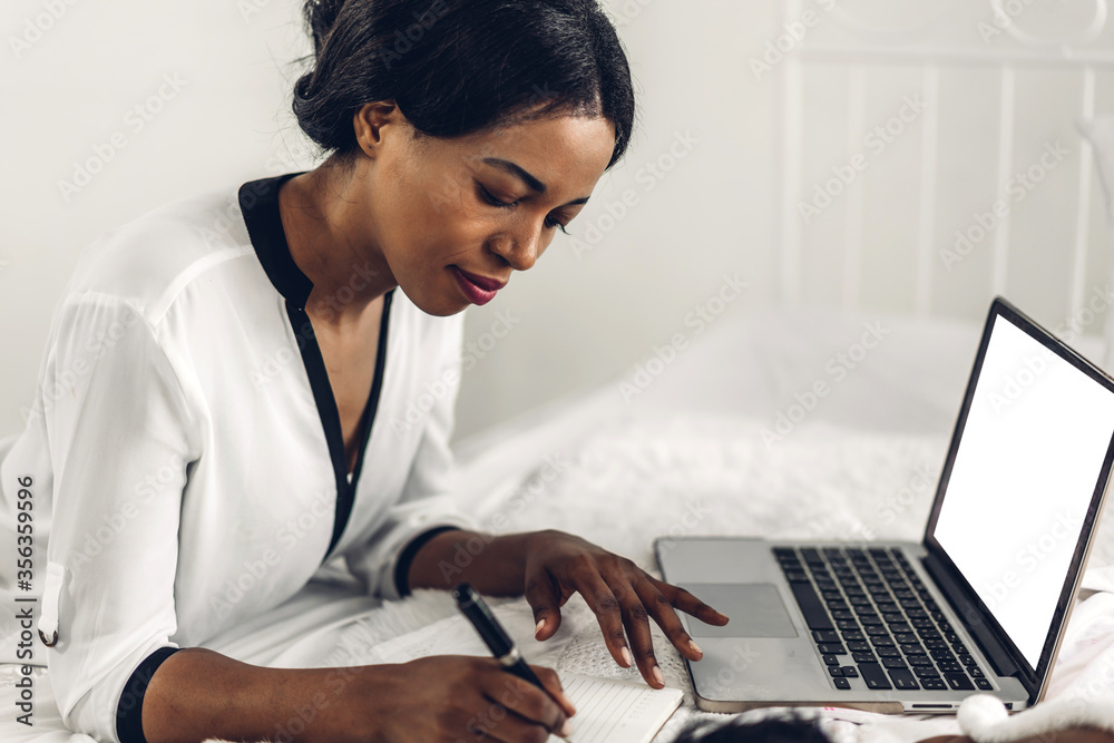Portrait of smiling happy african american black woman relaxing using ...