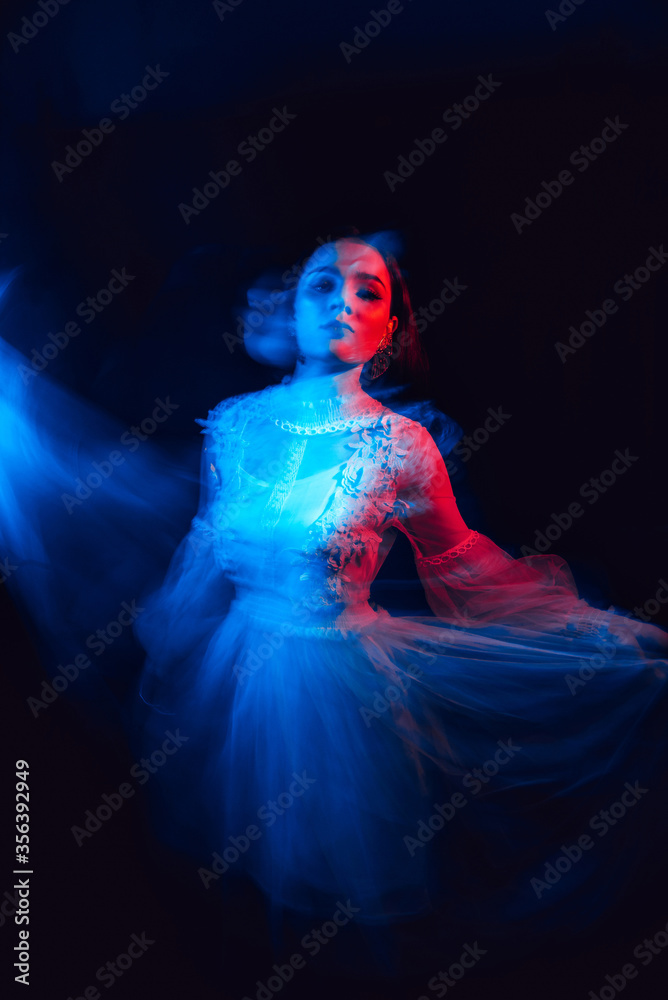sad Ghost girl in white dress dancing on dark background Stock Photo ...