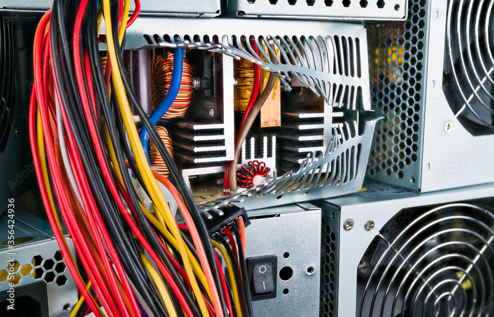 Inside of power supply unit with induction coils, heatsinks and ...
