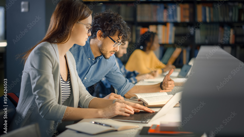 University Library: Talented Caucasian Girl uses Laptop, Smart Helpful ...