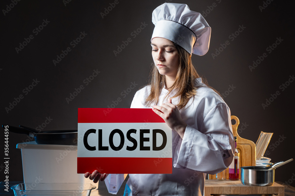 Restaurant is closed forever. Sad chef holds signboard closed. I Stock ...