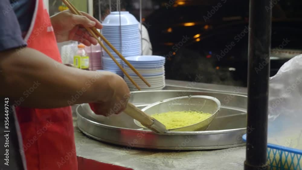 The owner of street food stall barrow restaurant, street noodle in ...
