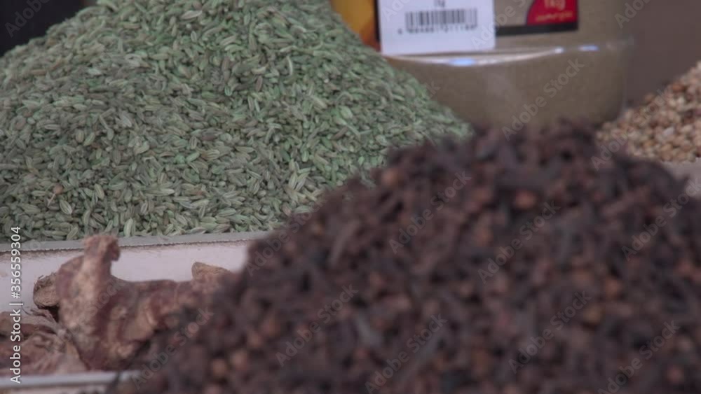 Edible seeds and condiments on display at the traditional spice market ...