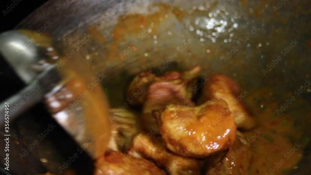 Cooking red chutney gravy in an Indian pan - Kadhai for Tibetan momos ...