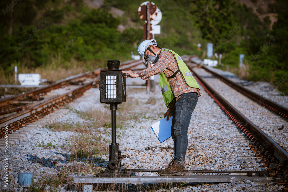 The engineer under inspection and checking construction railroad ...