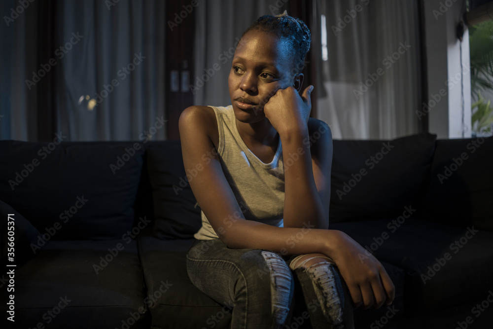 Millennial generation African American girl at night suffering ...