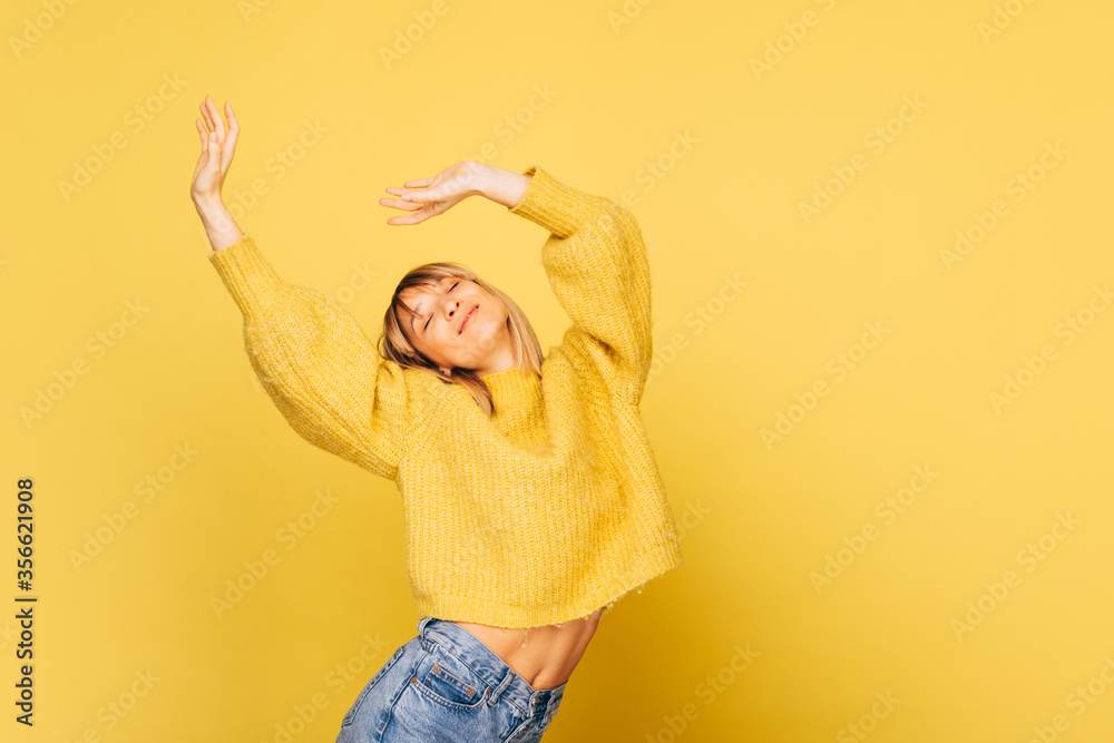 Modern trendy young woman holding hands up and leaning backwards. Girls ...