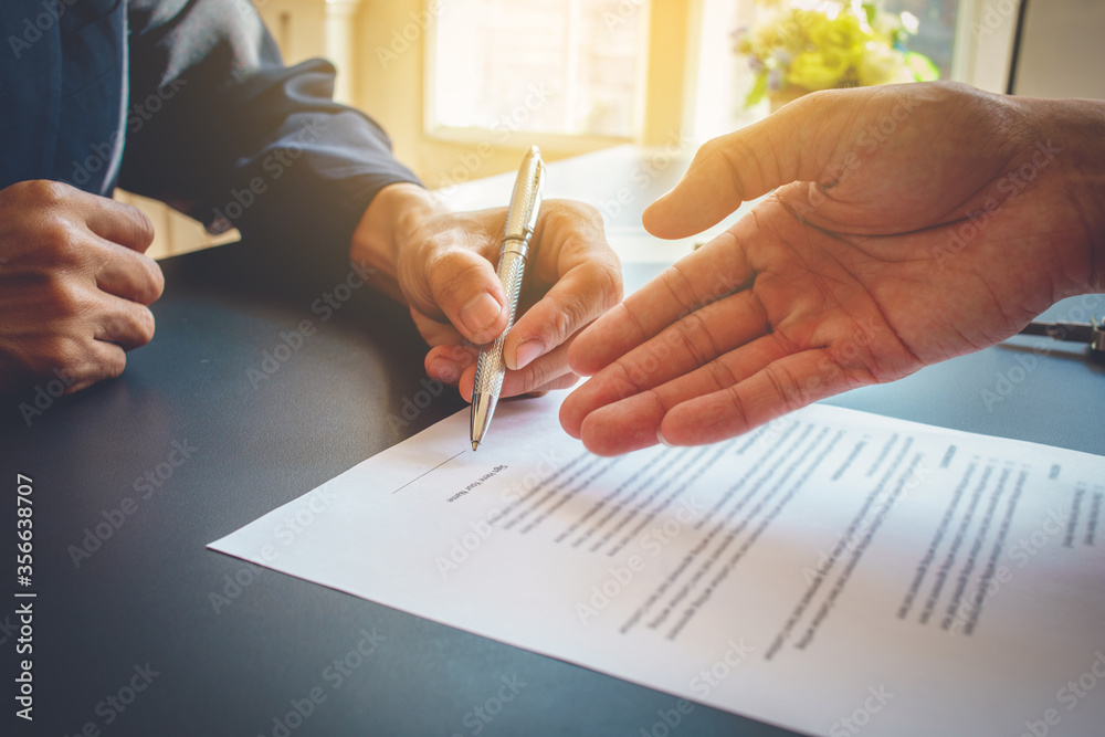 Signing a business contract, businessman agree to make deal signing ...