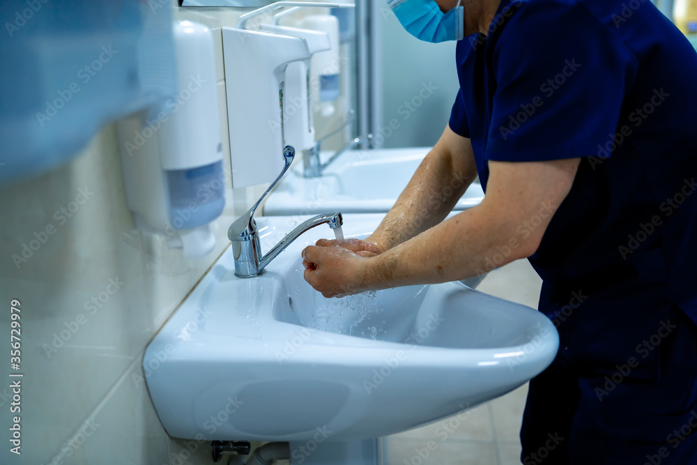 Doctor washing hands. Surgeon washing hands before operating process ...