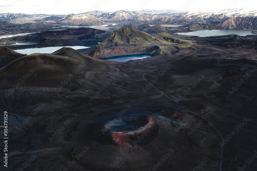 Aerial view of deserted landscape,with volcano craters, glacial lakes ...