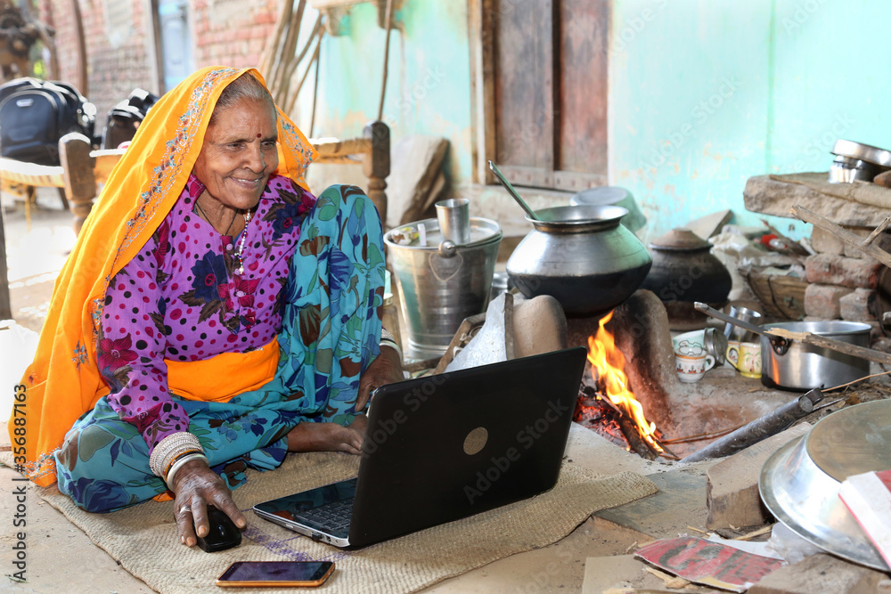 Old Indian traditional lady amazed using Laptop. Indian grandma using ...
