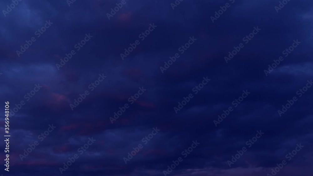 Stormy clouds moving fast on evening and make sky dark as fade in ...