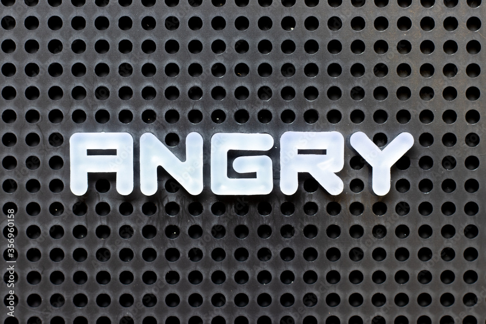 White color alphabet with word angry on black pegboard background Stock ...