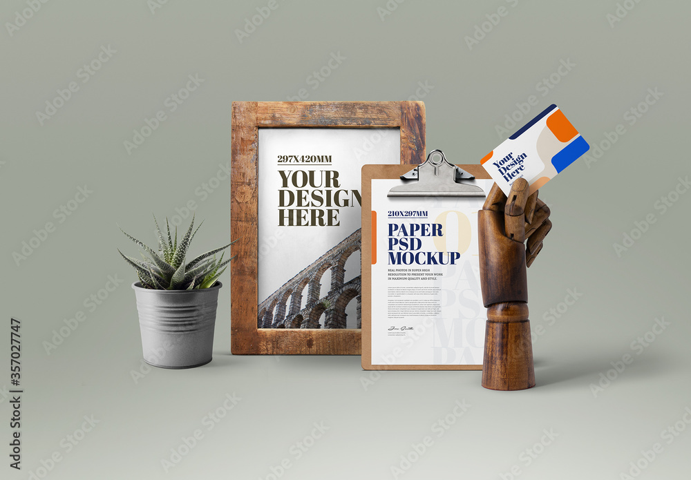 Business Card, Frame, and Clipboard with Wooden Hand Mockup Stock ...