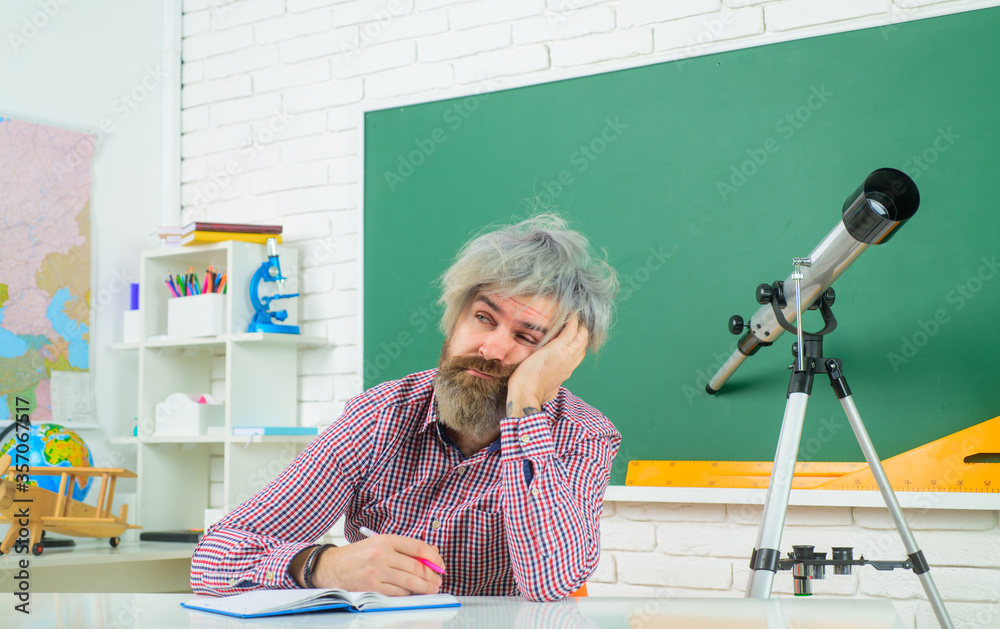 Back to school. Tired teacher in classroom. Learning, education, school ...