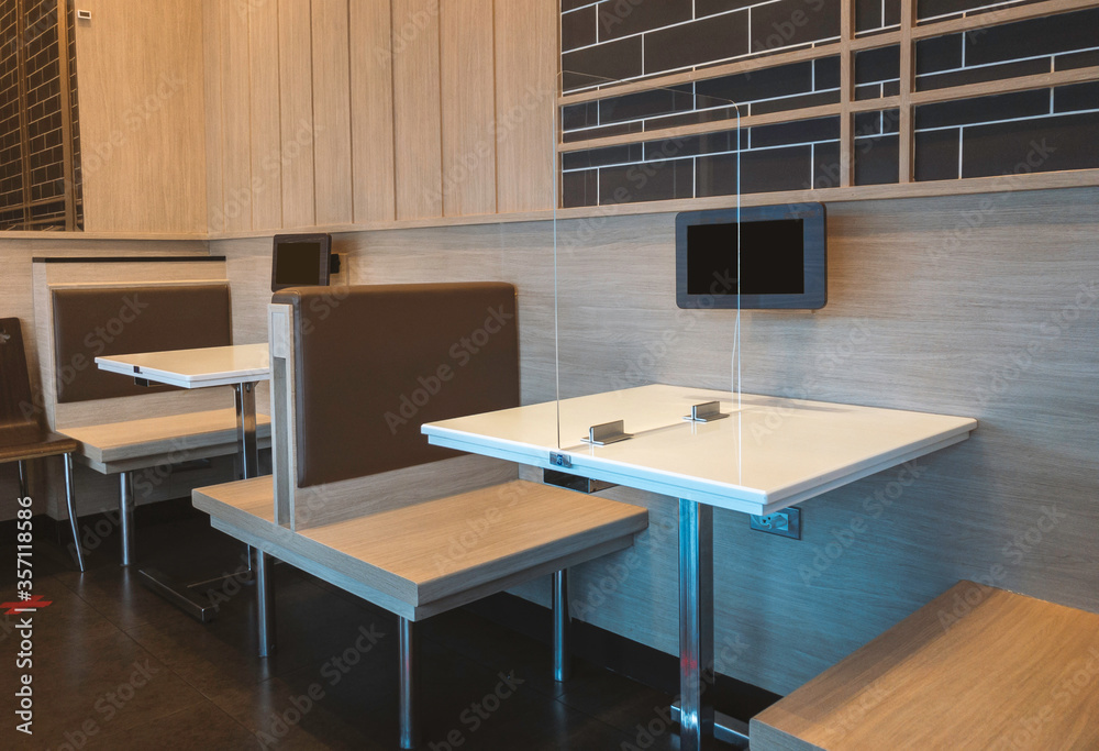 Cleared glass shield to protect virus on small table for two people ...