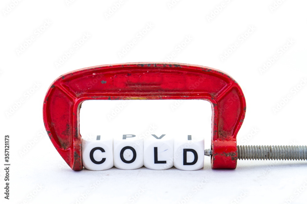 The text spelling out the word cold in a red metal clamp isolated on a ...