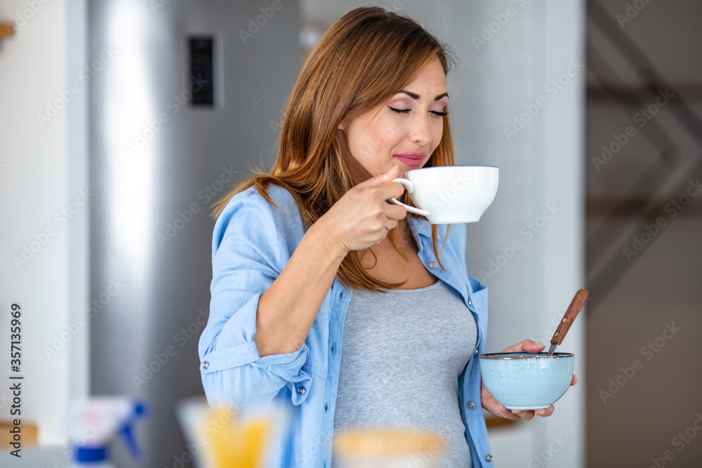 Shot of a young woman having her morning coffee. What a great way to ...