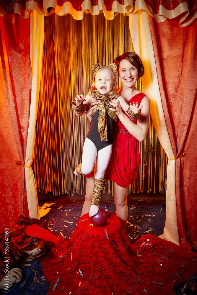 Family during a stylized theatrical circus photoshoot in a beautiful ...