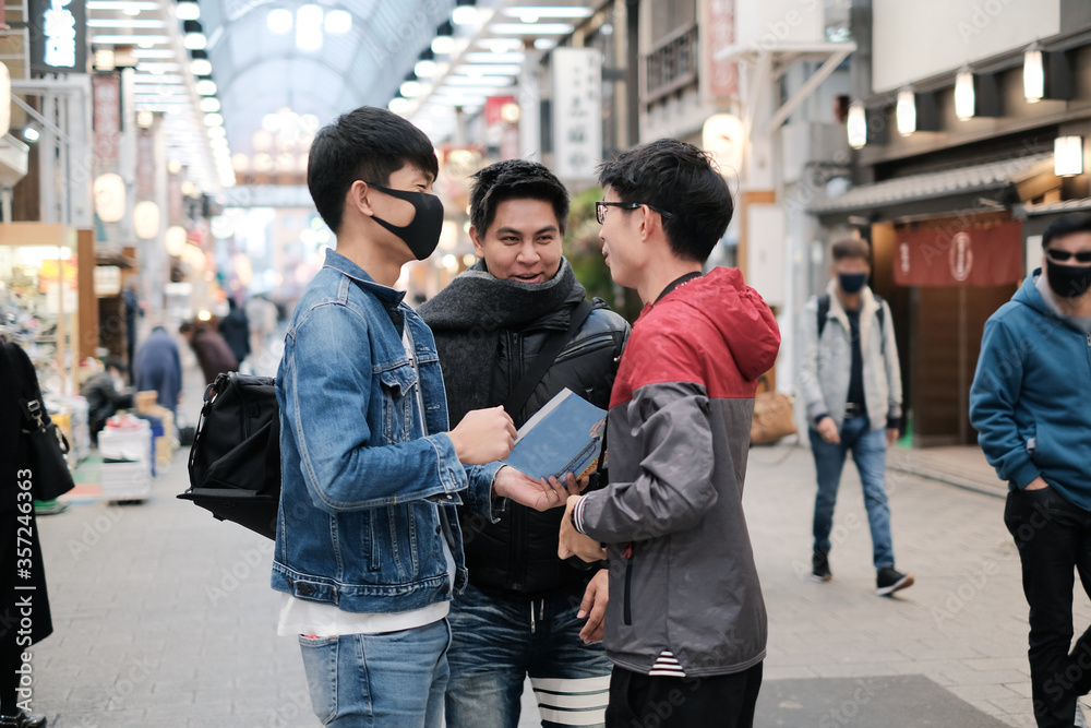 Group of young asian friends talking about the trip to travel on ...
