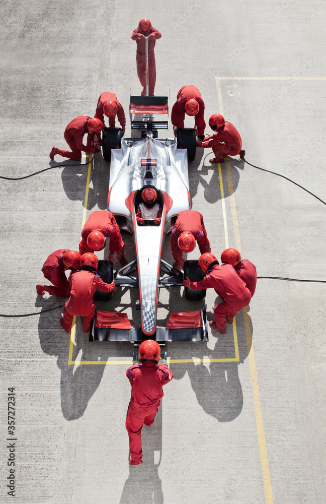 Racing team working at pit stop Stock Photo | Adobe Stock