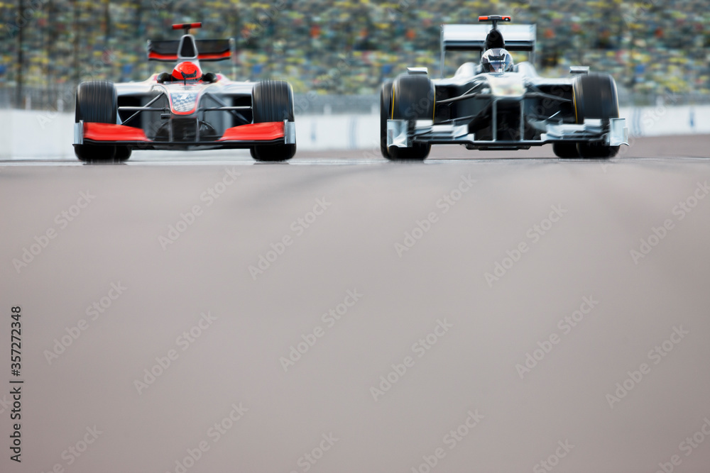 Race cars driving on track Stock Photo | Adobe Stock