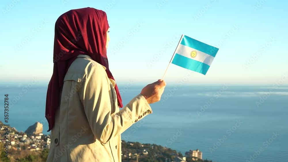 Islam in Argentina. Modern Muslim woman in hijab with flag of Argentina ...