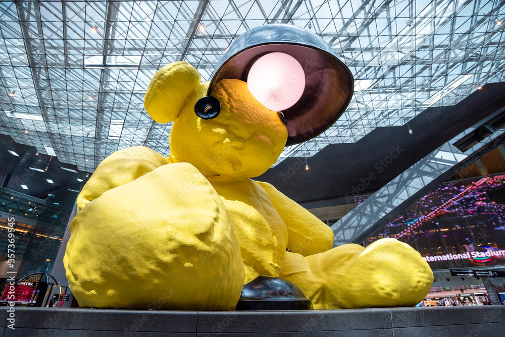 The canary yellow lamp teddy bear iconic airport landmark in the middle ...
