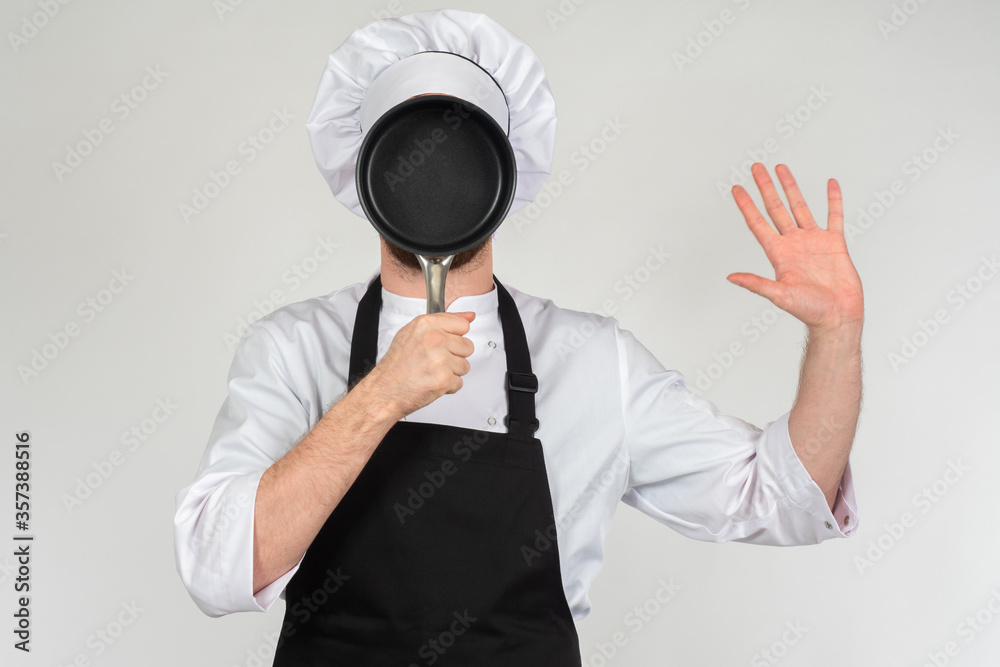 The cook is joking. Culinary humor. The chef covered his face with a ...