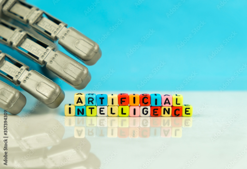 Conceptual machine learning. Robotic hand represents besides alphabet ...