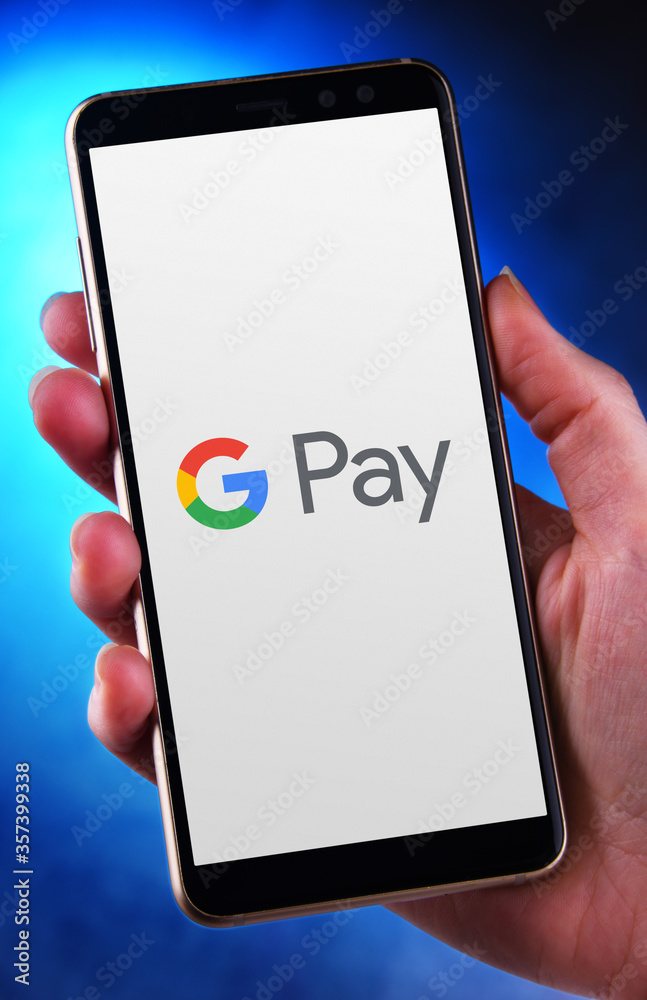 Hand holding smartphone displaying logo of Google Pay Stock Photo ...
