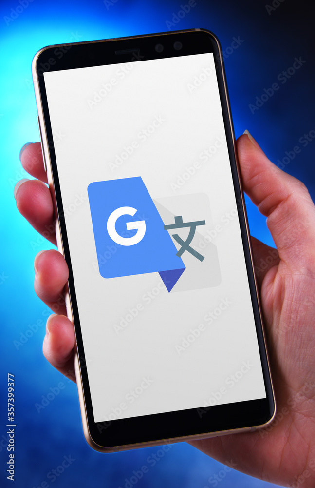Hand holding smartphone displaying logo of Google Translate Stock Photo ...