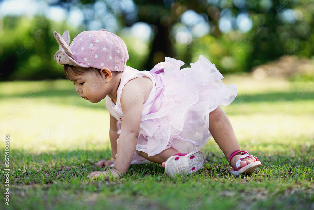 Cute little baby girl try to stand up after fell down.concept learning ...