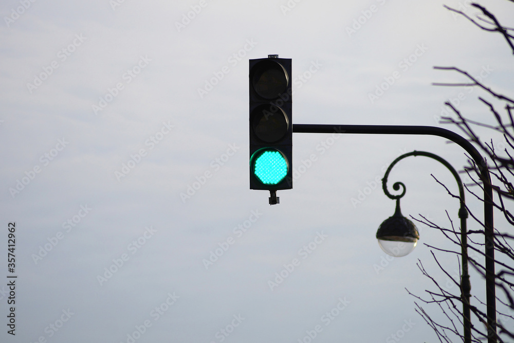 Pedestrian traffic light with green signal. Green traffic light on sky ...