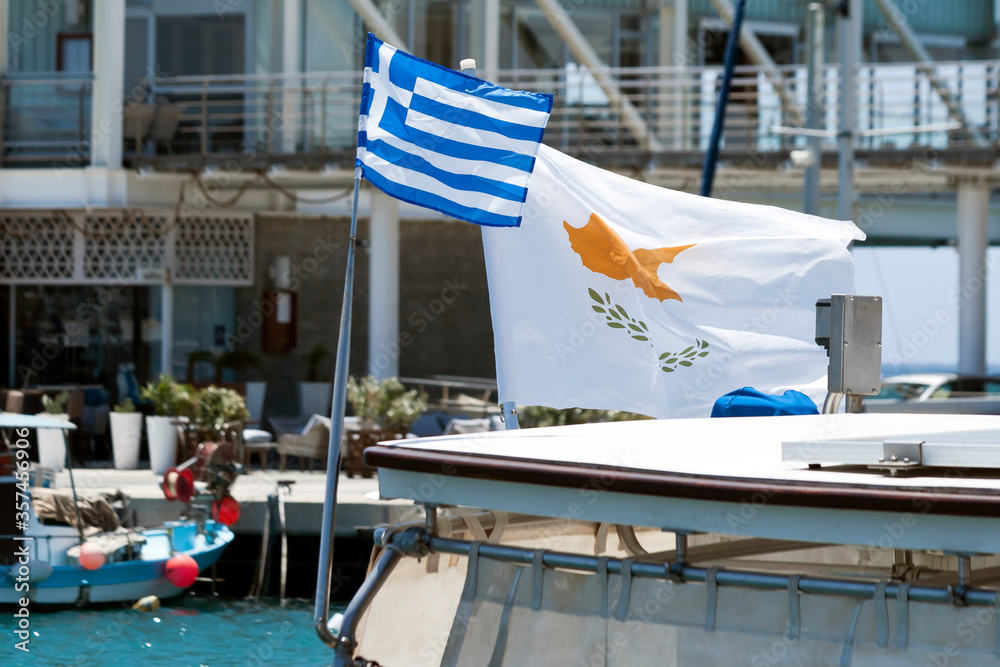 Greek and Cypriot national flags at sea harbor Stock Photo | Adobe Stock