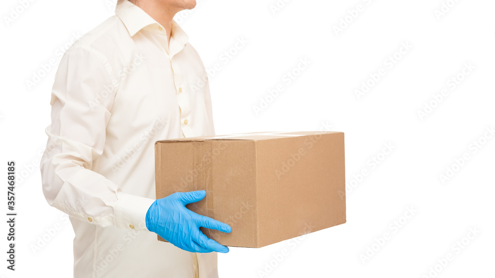 deliveryman hands in sterile gloves of courier for safe delivery parcel ...