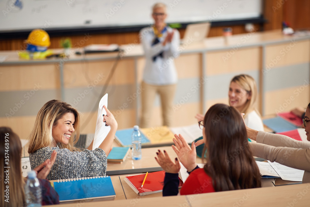 Students congratulating for passed exam Stock Photo | Adobe Stock